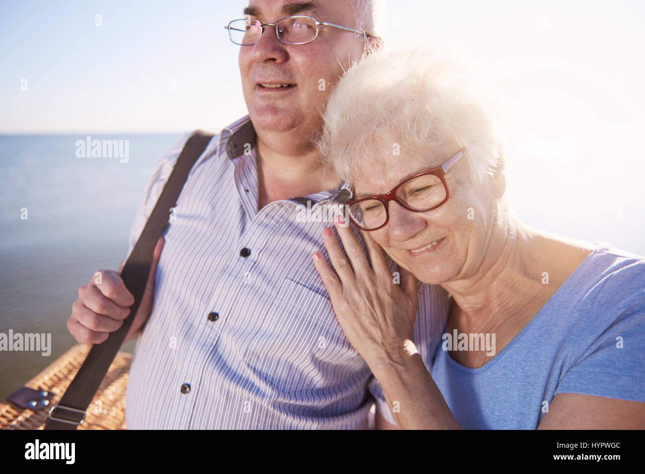 Seniors hugging while going on picnic Stock Photo - Alamy