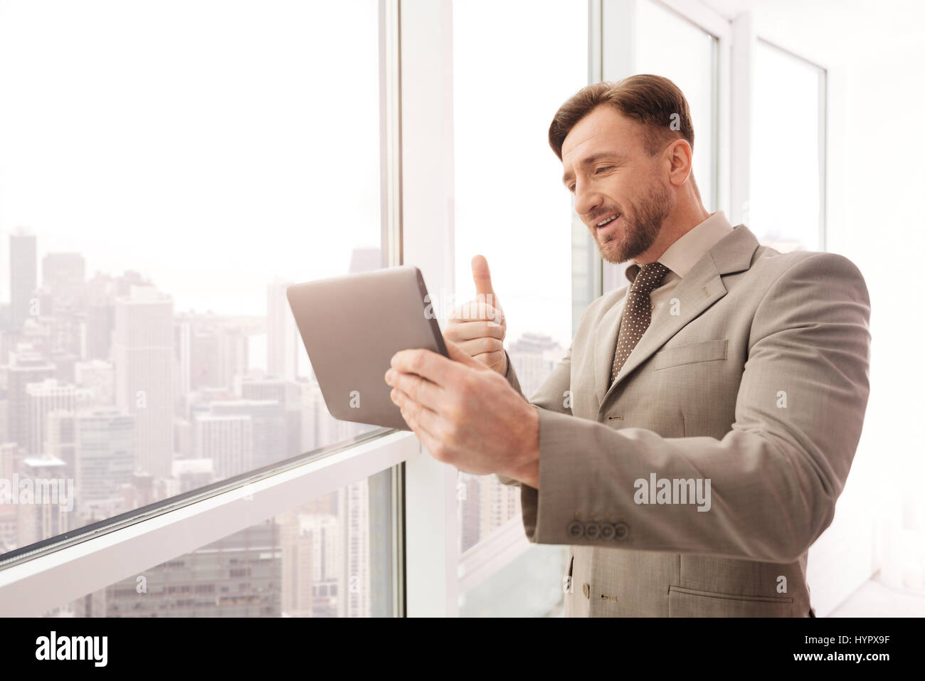 Cheerful businessman talking through the Internet Stock Photo - Alamy