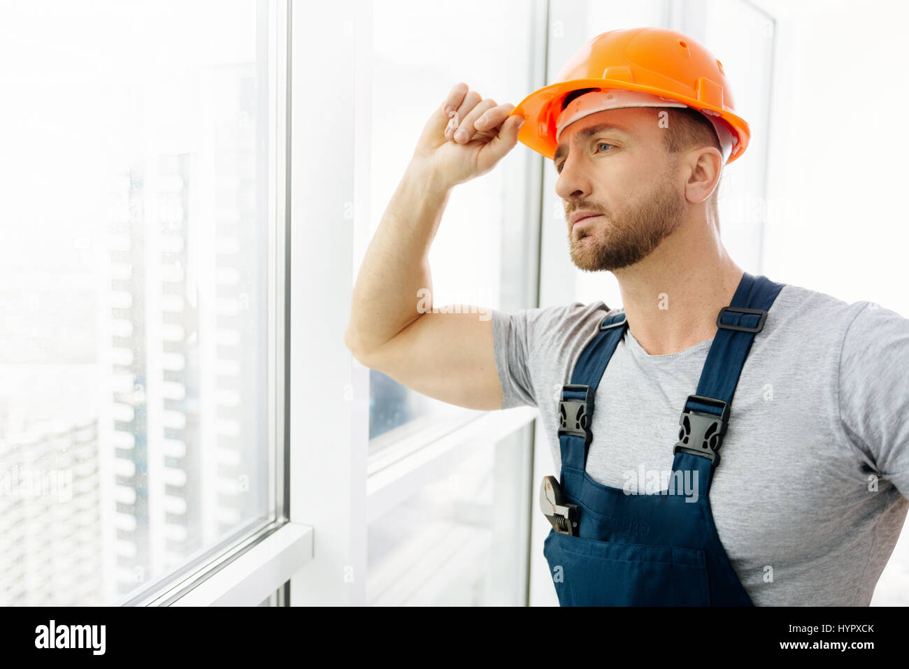 Waist up of construction engineer standing in the office Stock Photo ...