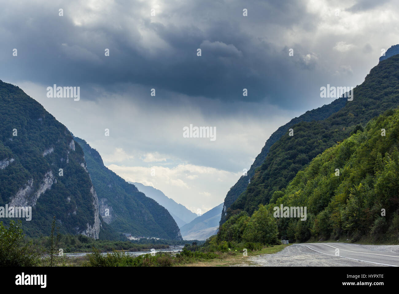 Cinematic road landscape. Asphalt Road throuth the mountains. With ...