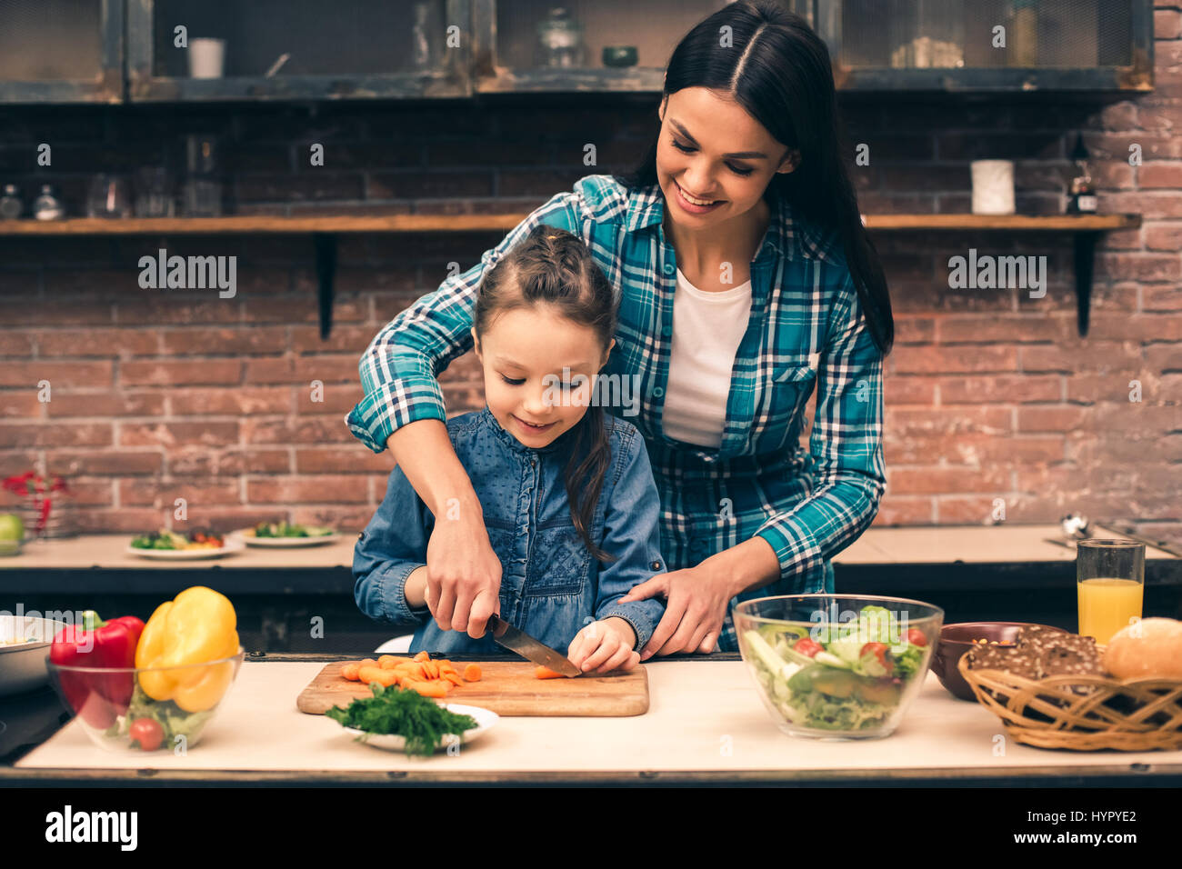 Happy daughter enjoying lunch hi-res stock photography and images - Alamy