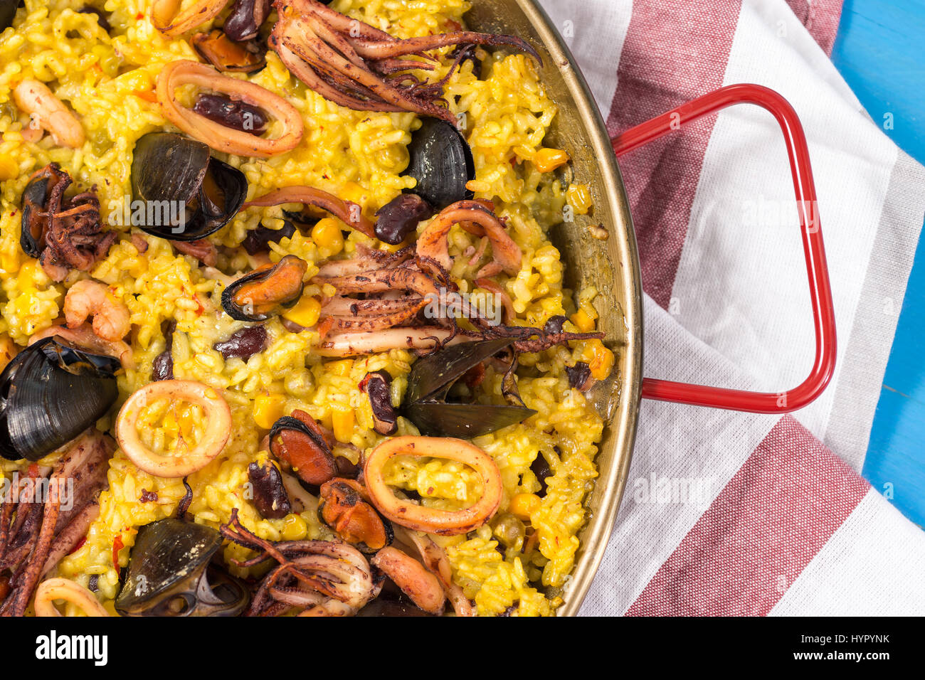 Spanish Seafood Paella in Traditional Pan on Rustic Wooden Table Stock ...