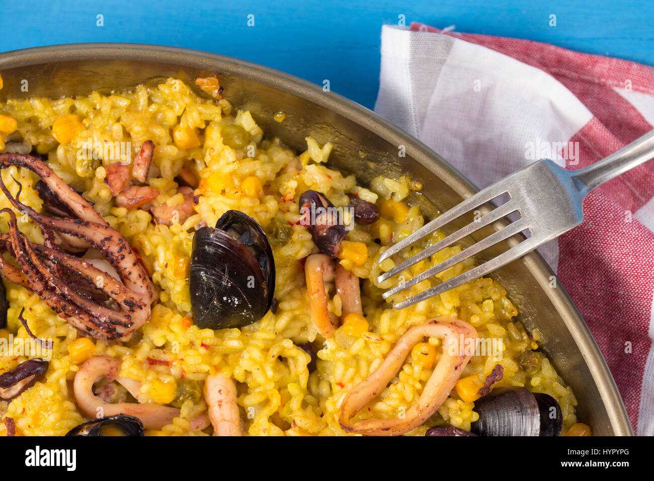 Spanish Seafood Paella in Traditional Pan on Rustic Wooden Table Stock ...