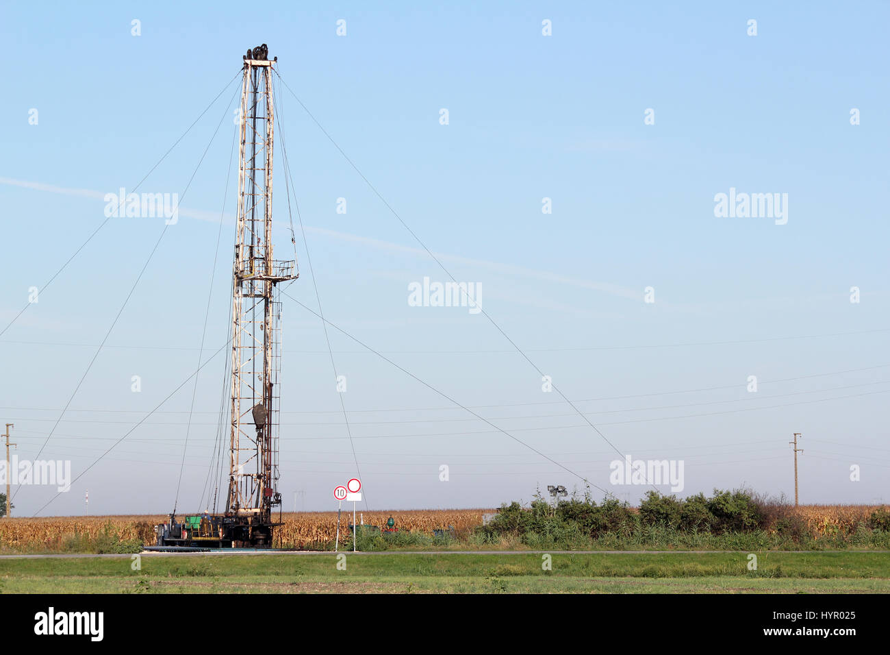 field with oil drilling rig industry Stock Photo - Alamy