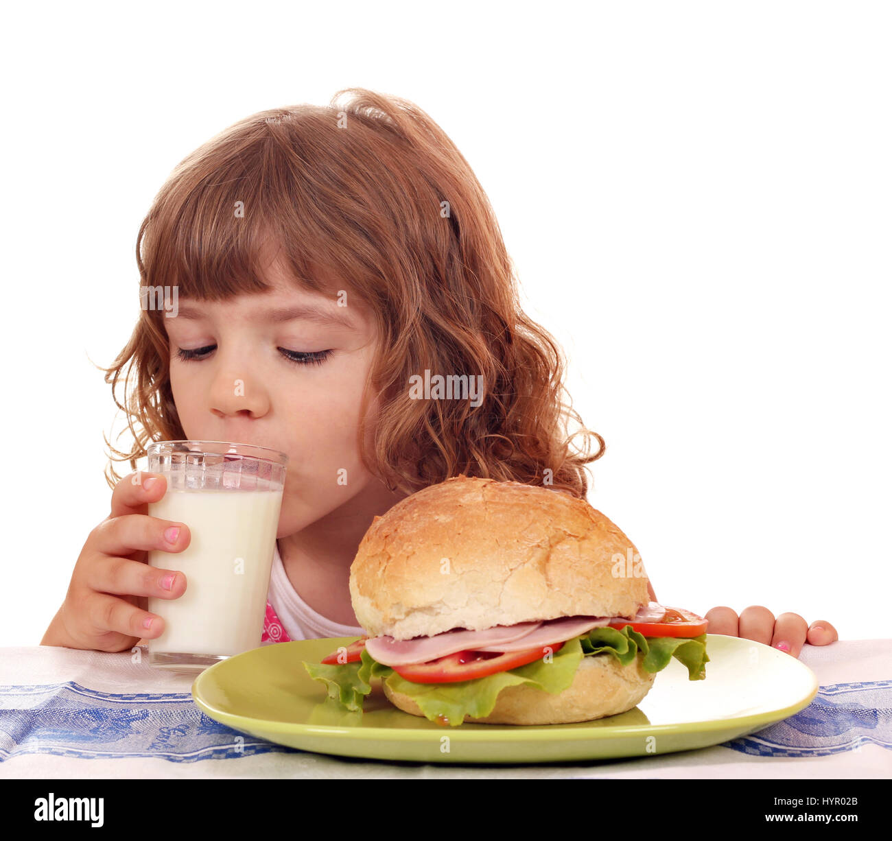 hungry little girl breakfast time Stock Photo - Alamy