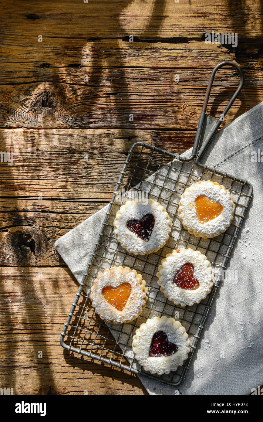 Heart cut out cookie still life with natural light streaming in. Shot ...