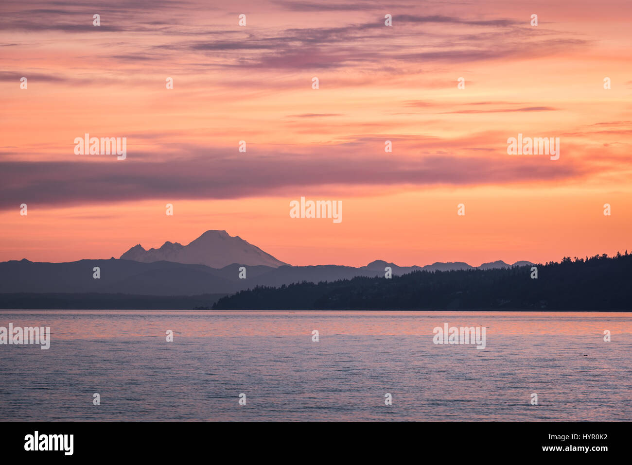 Pink dawn sky over Puget Sound and Mount Baker in Western Washington ...