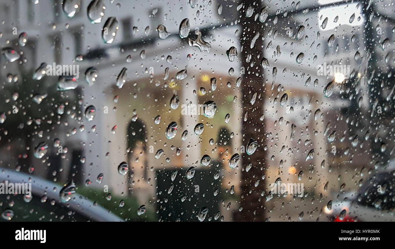 New Orleans downtown, traffic view through the car window. Rain drops ...