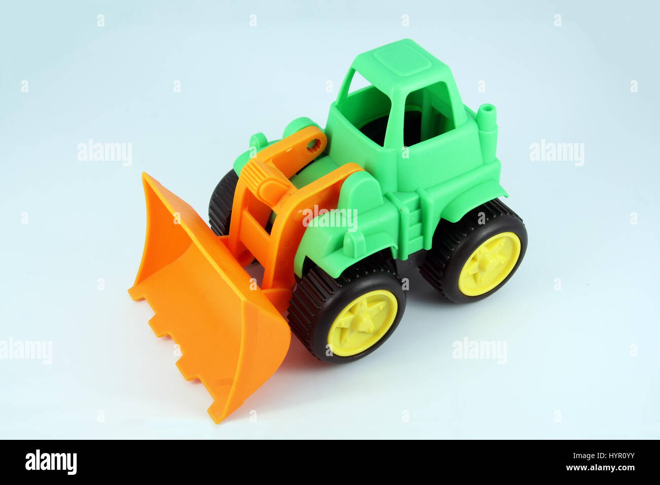 Bulldozer toy. Small Dredge toy model Stock Photo - Alamy