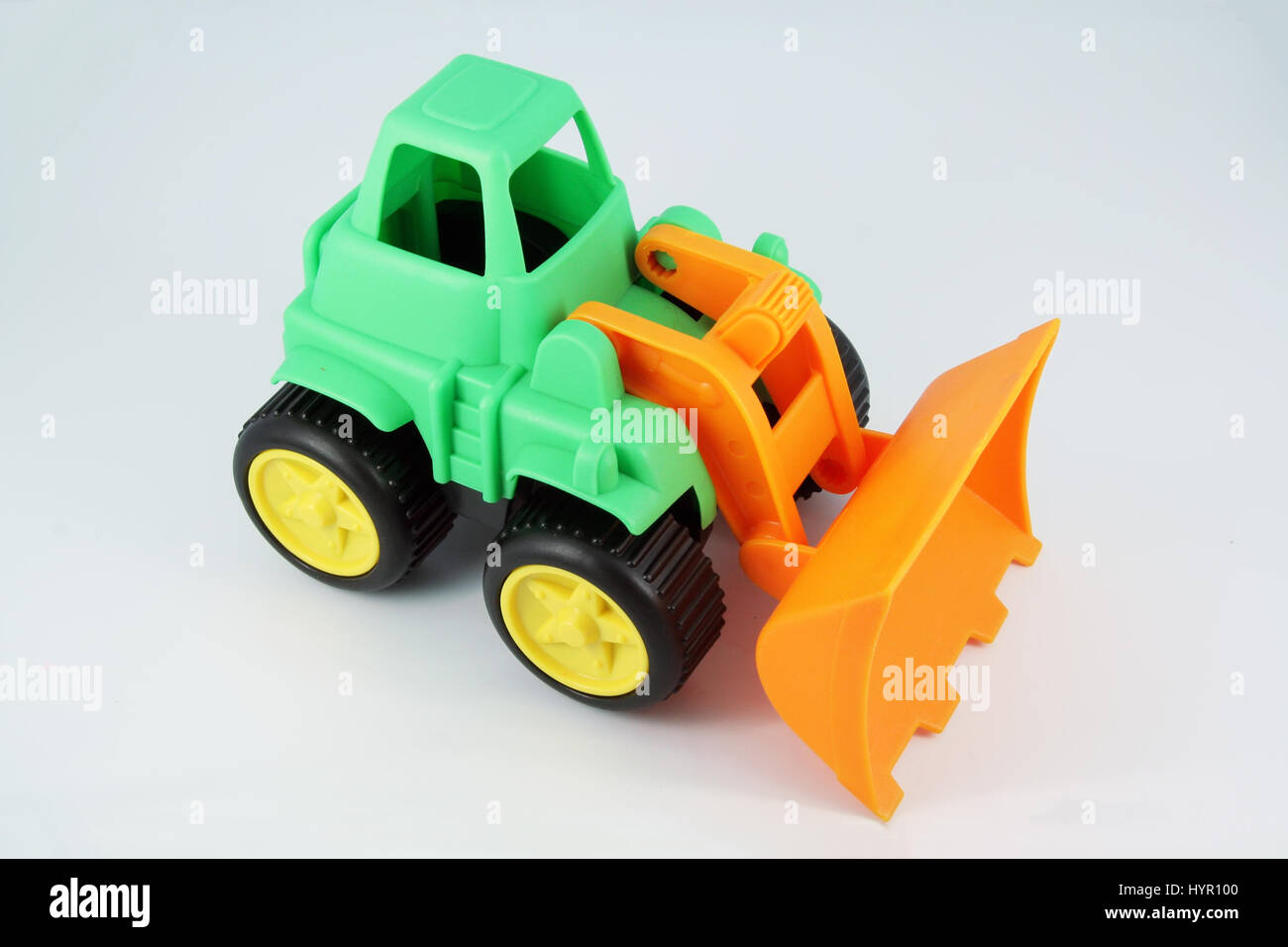 Bulldozer toy. Small Dredge toy model Stock Photo - Alamy