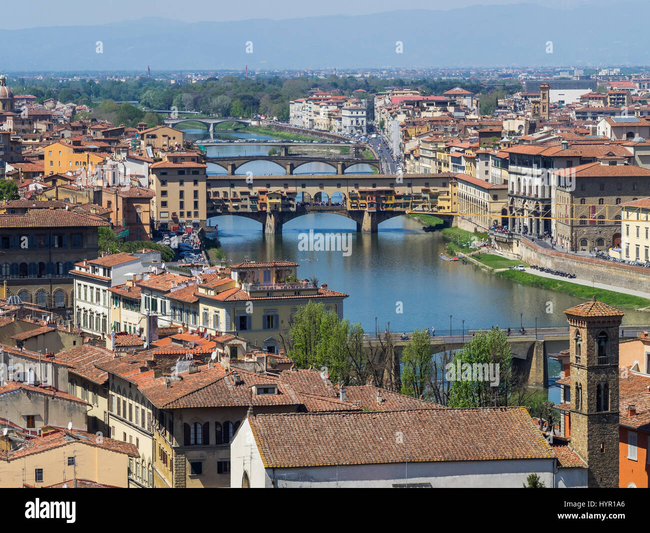 View along River Arno across city towards Ponte Vecchio (old bridge) in ...