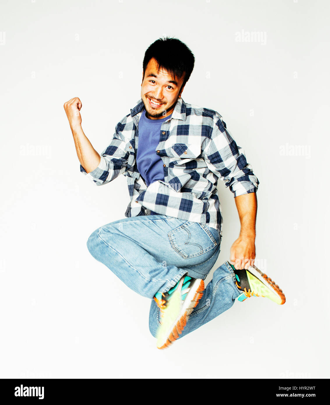 young pretty asian man jumping cheerful against white background Stock ...