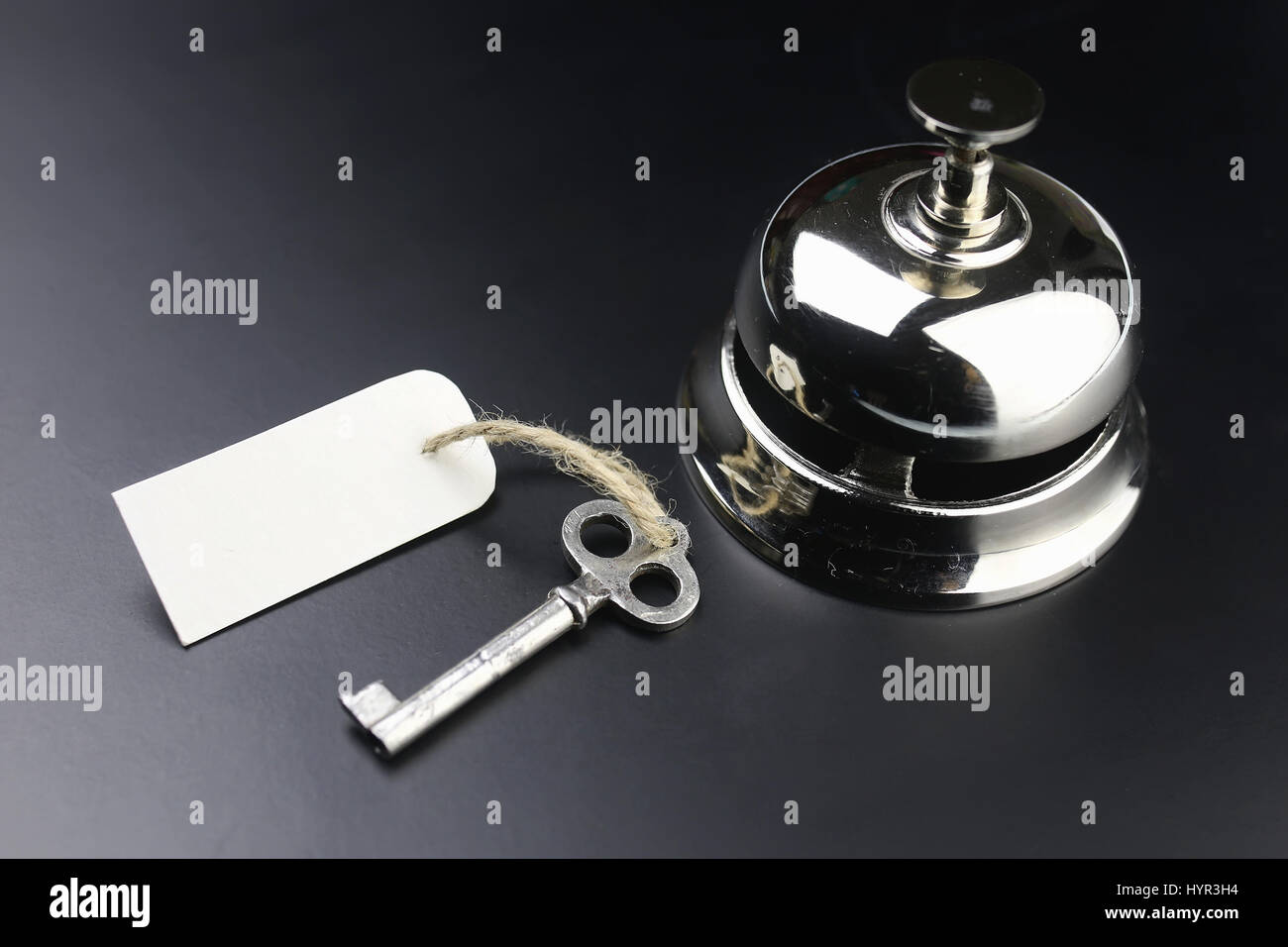 bell and the key at the reception in the hotel Stock Photo - Alamy