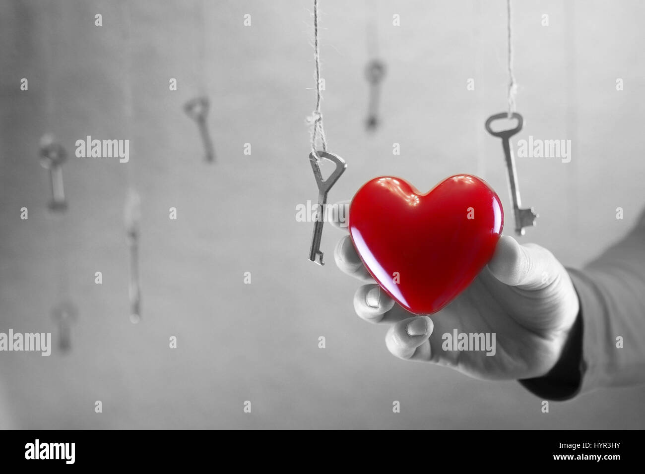 hand stretching for one of the many old vintage keys Stock Photo - Alamy