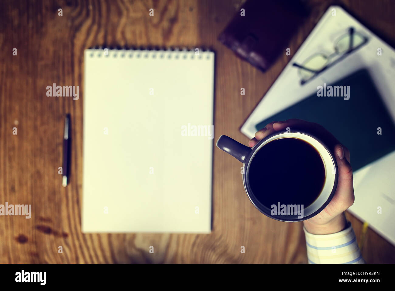 toned table write hand top view Stock Photo - Alamy