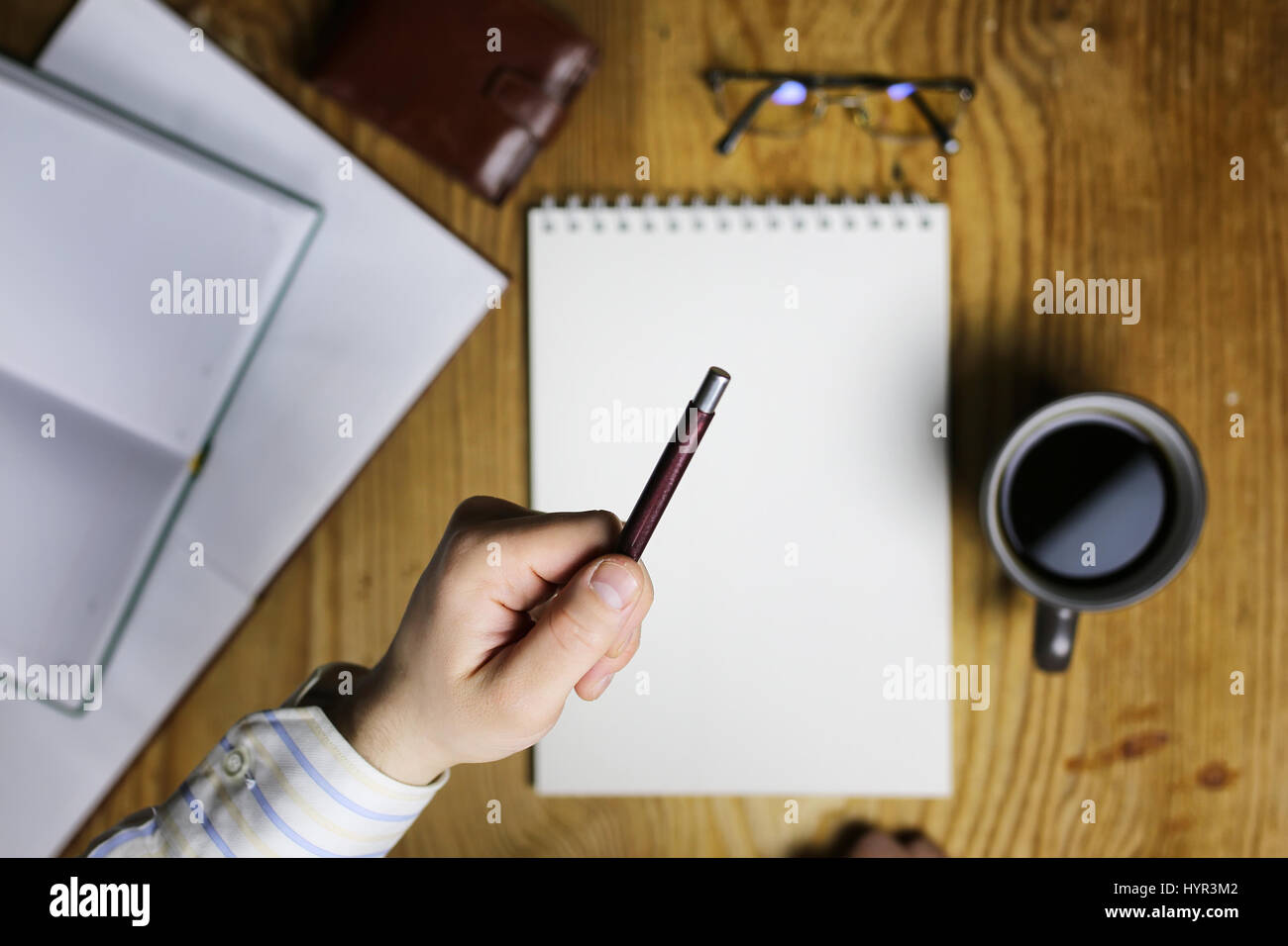 table write hand office view Stock Photo - Alamy