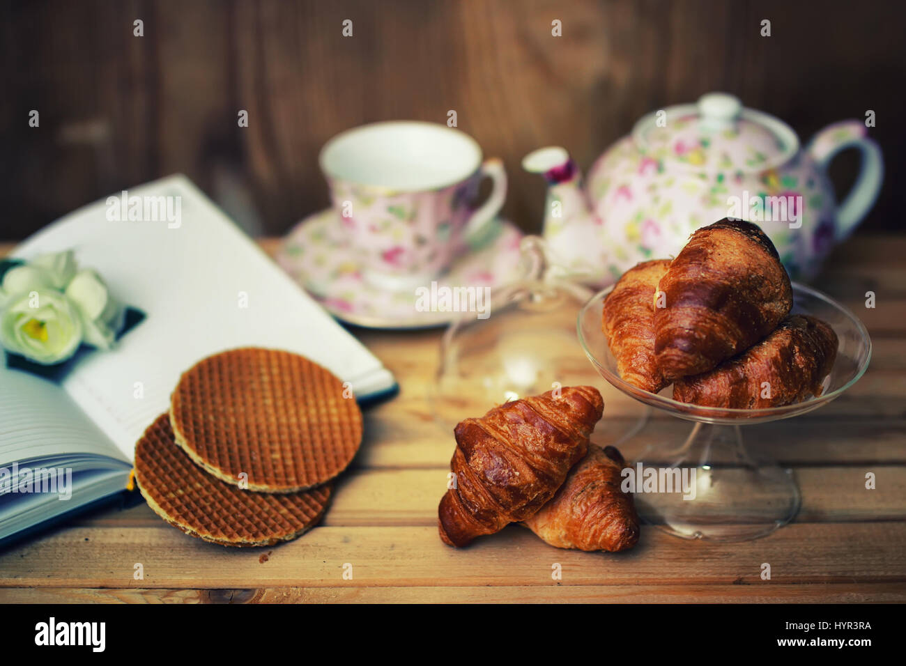tea cup croissant book Stock Photo - Alamy