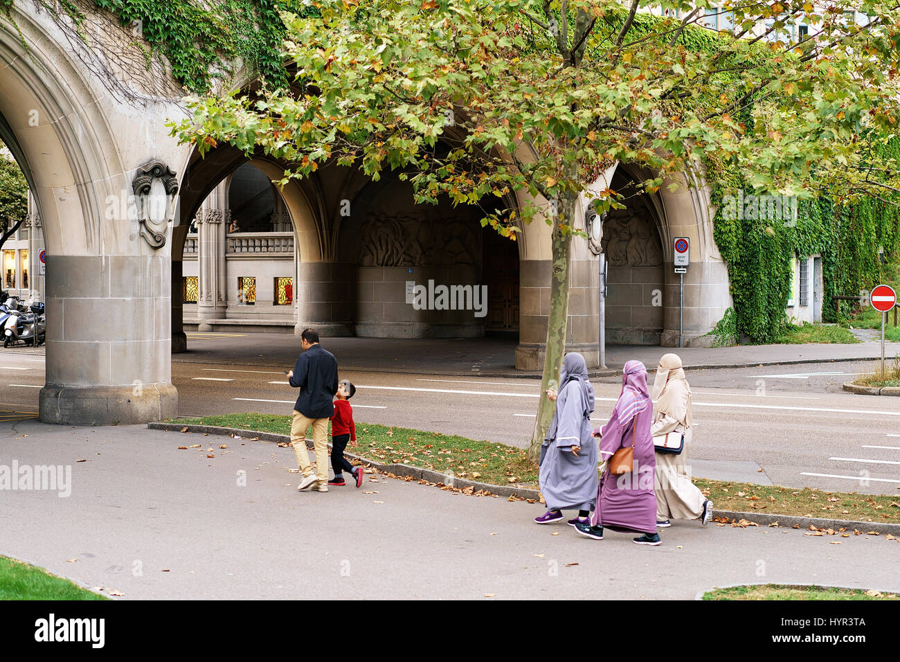 Traditional muslim family with husband and a child and three women in ...