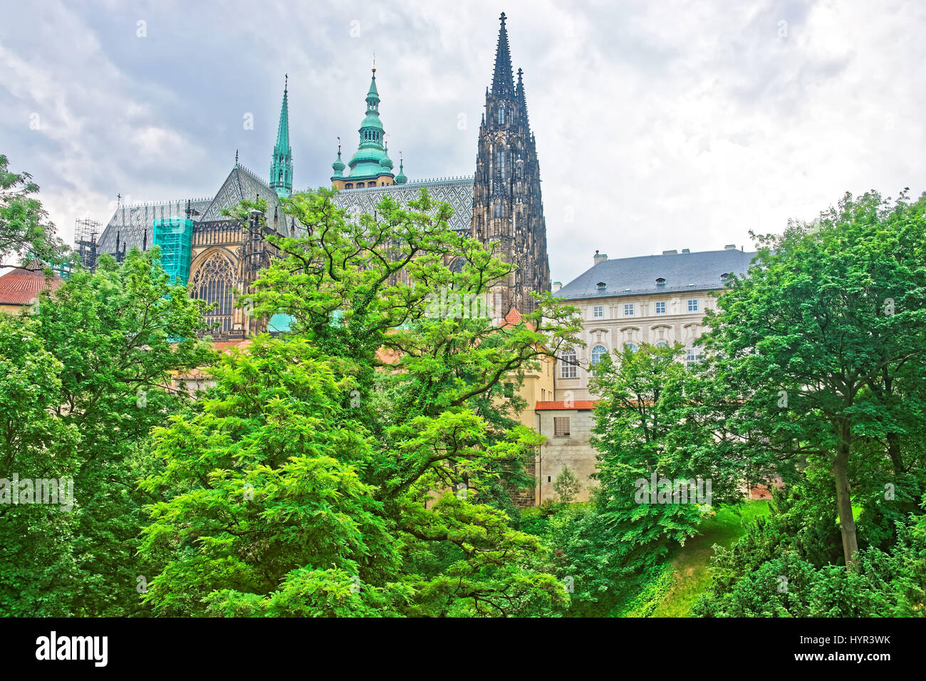 Saint Vitus Cathedral among green trees in Old town of Prague, Czech ...