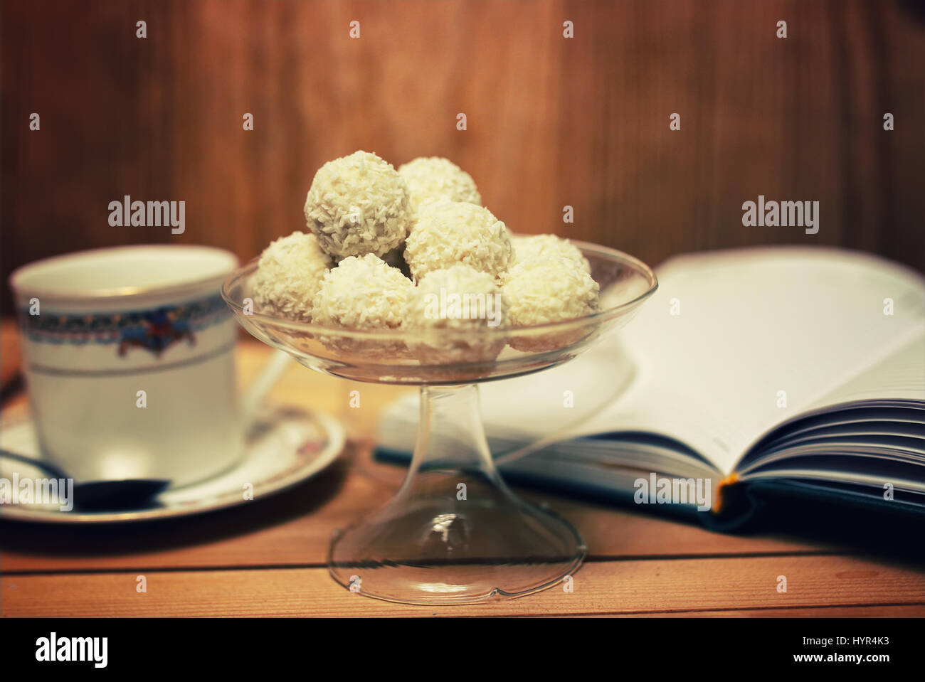 reading book with tea flower and sweet Stock Photo - Alamy