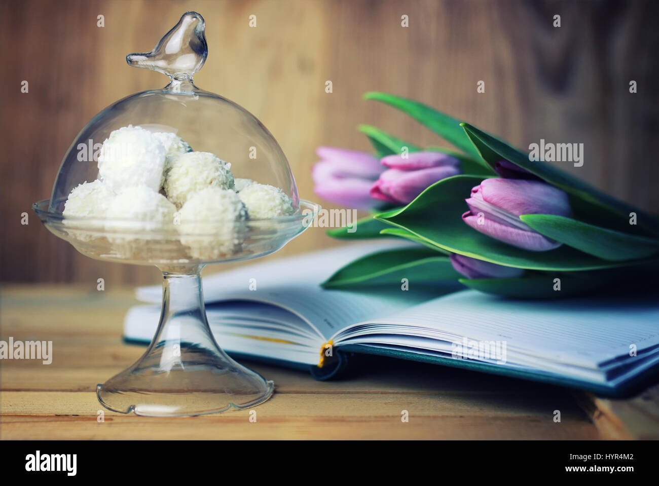 reading book with tea flower and sweet Stock Photo - Alamy