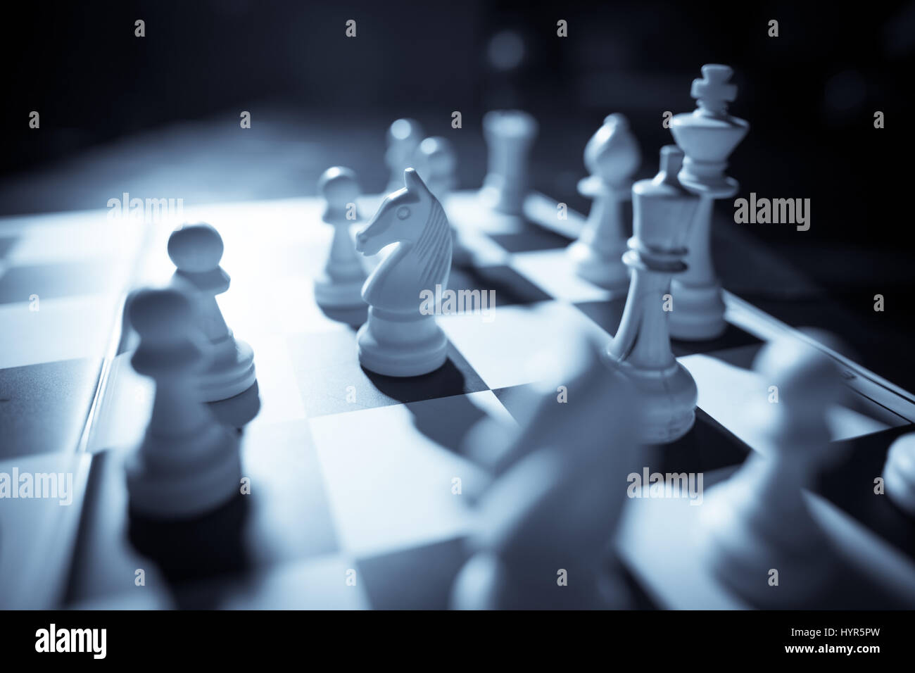 Image of the white pieces on a chess board, with shallow depth of field ...
