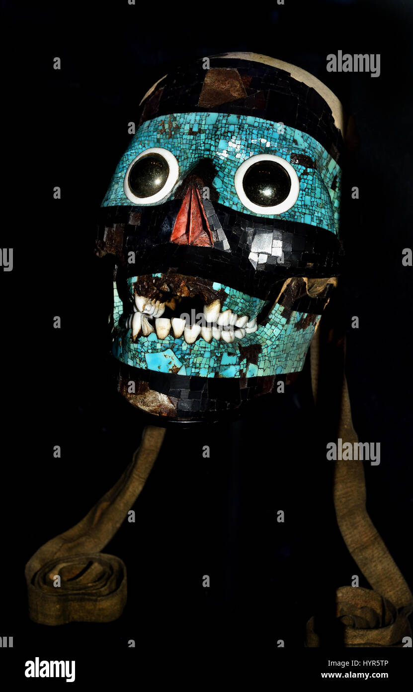 Human skull covered with turquoise and lignite mosaic. The nasal cavity ...