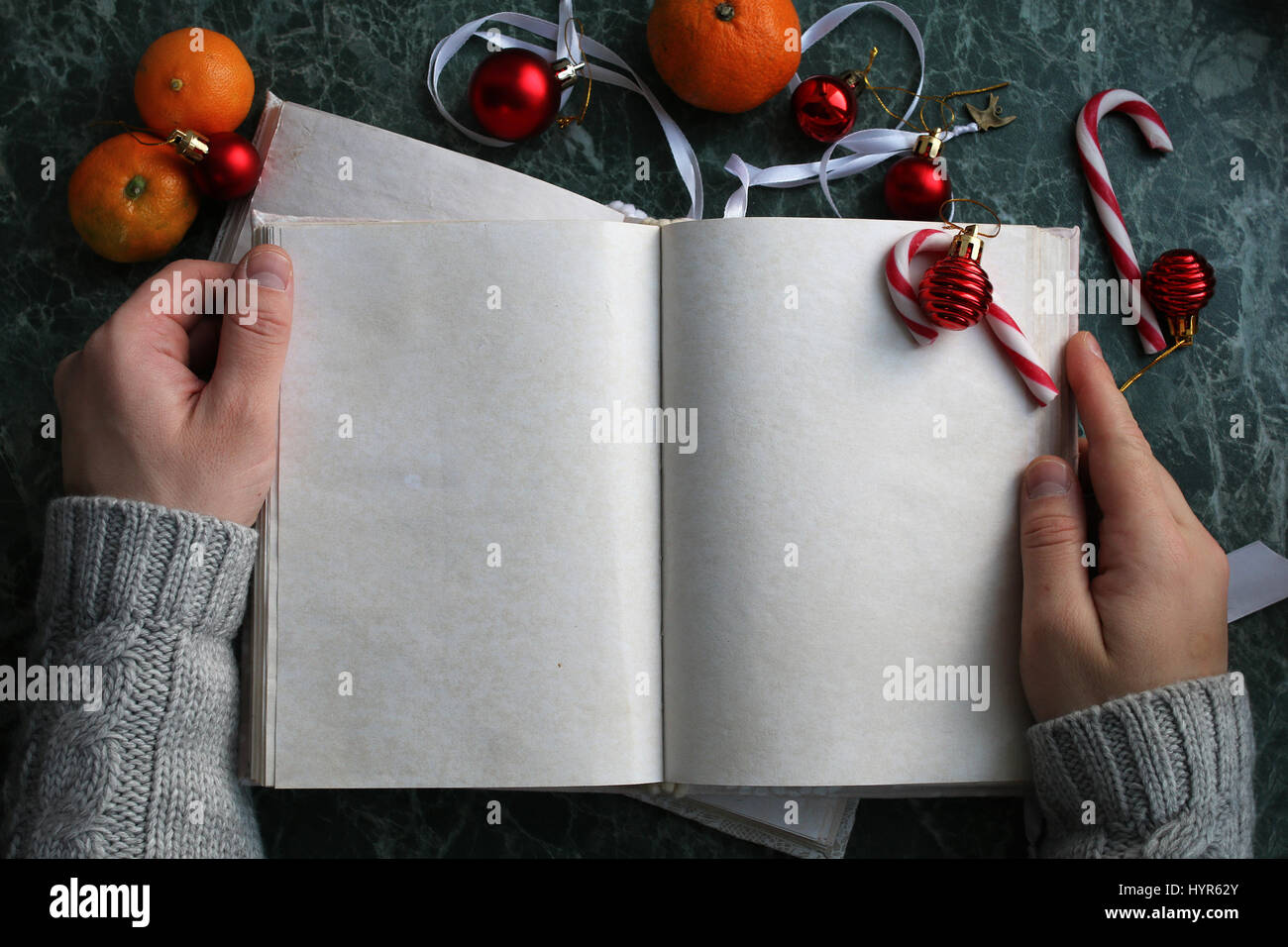 pages opened vintage book on green marble countertop Stock Photo - Alamy