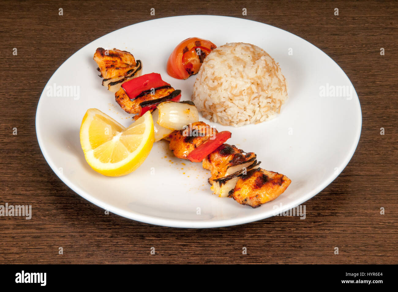 Grilled meat dish of shish kebab with onion Stock Photo - Alamy