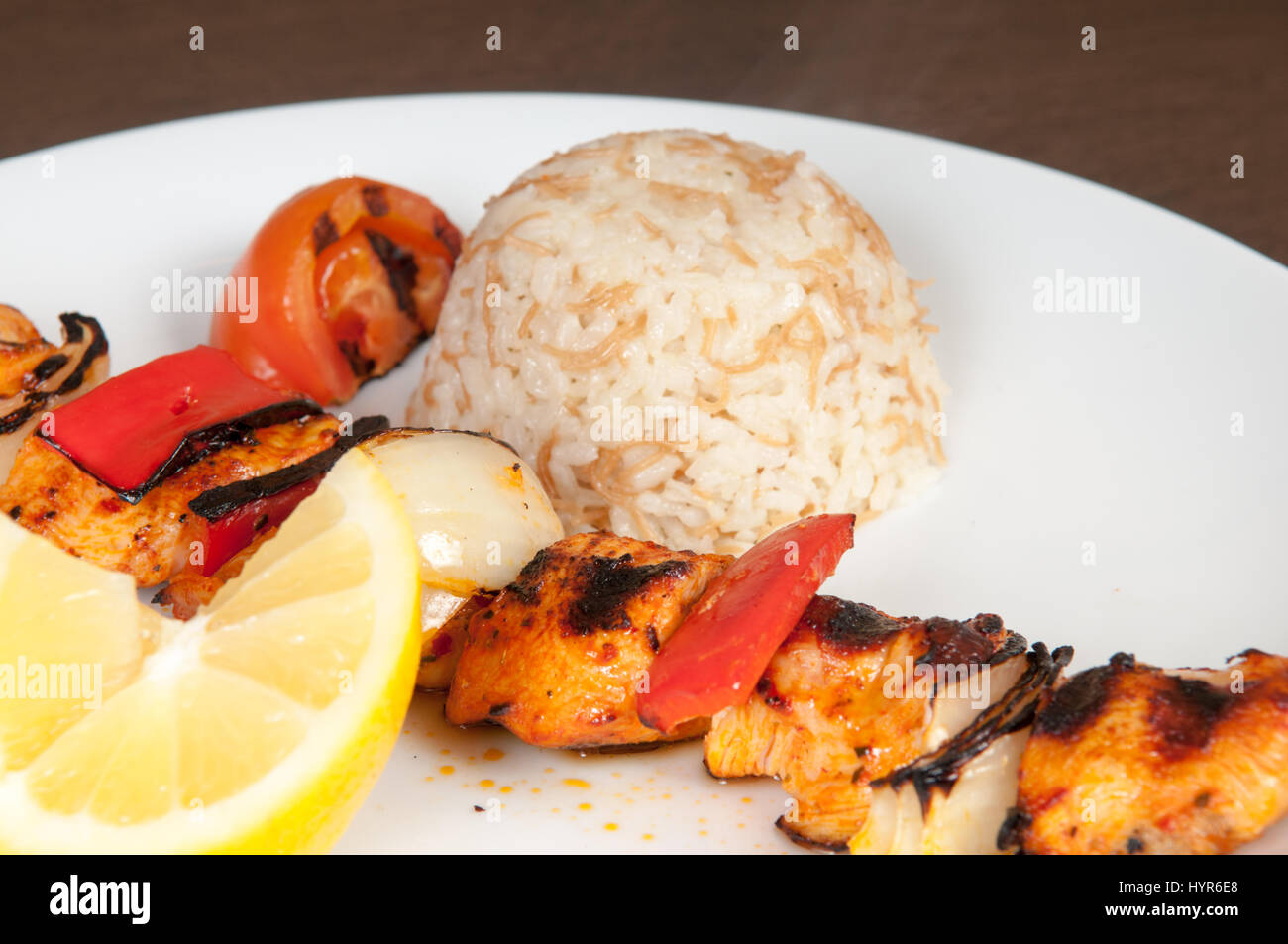 Grilled meat dish of shish kebab with onion Stock Photo - Alamy