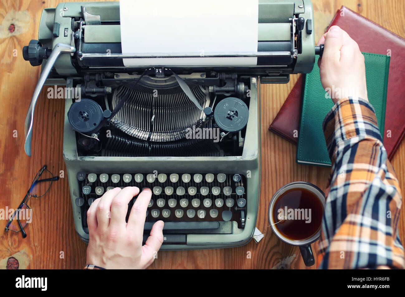 typewriter retro hand on wooden table Stock Photo - Alamy