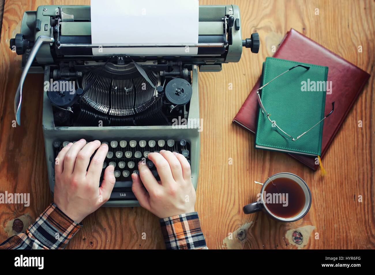 typewriter retro hand on wooden table Stock Photo - Alamy