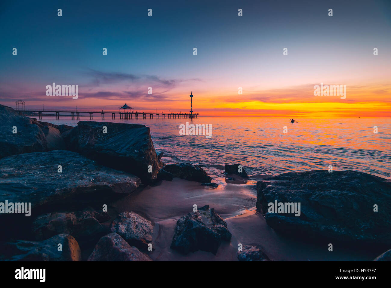 People walking along Brighton Jetty at sunset. South Australia Stock ...