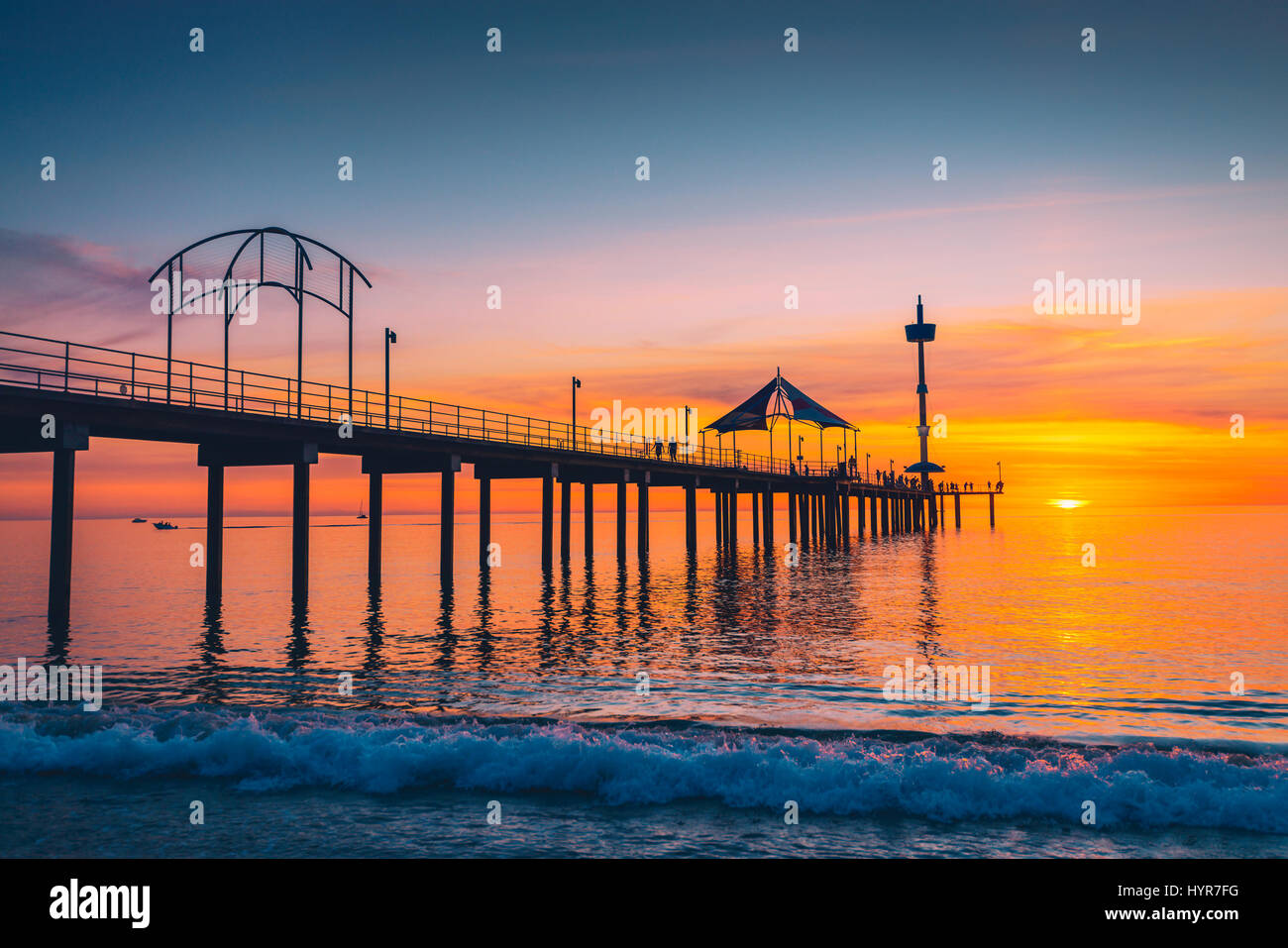 People walking along Brighton Jetty at sunset. South Australia Stock ...