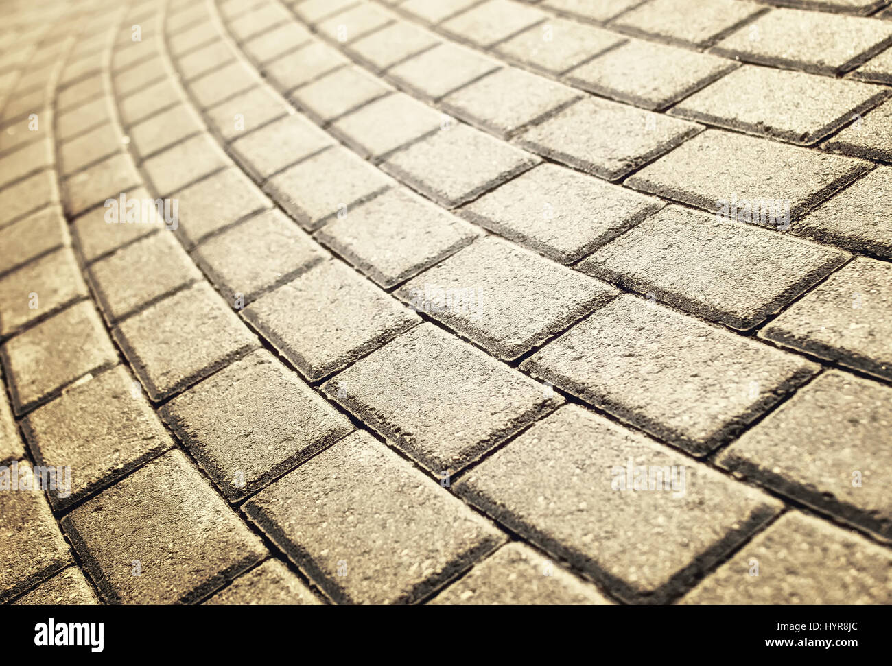 sunlight on paved cobblestone pavement Stock Photo - Alamy