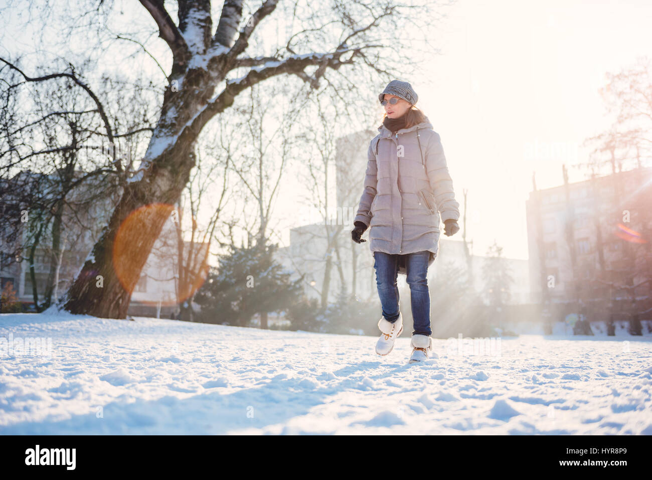 Woman walking in park winter hi-res stock photography and images - Alamy