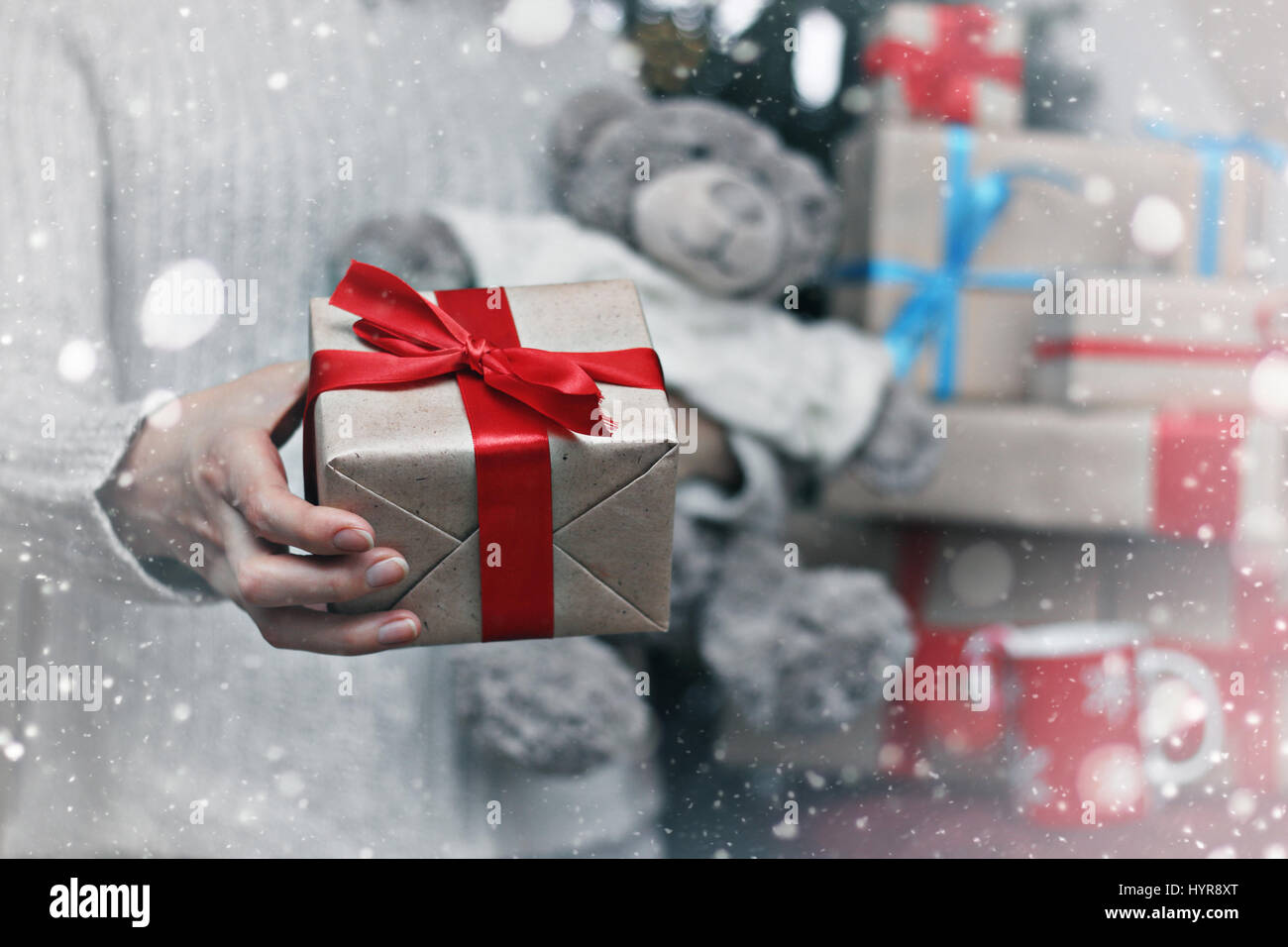 gift giving hand christmas Stock Photo - Alamy