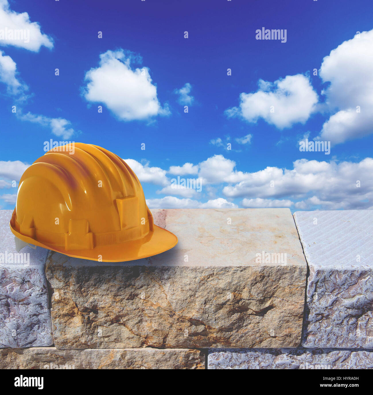 helmet construction of brick wall with blue sky Stock Photo - Alamy