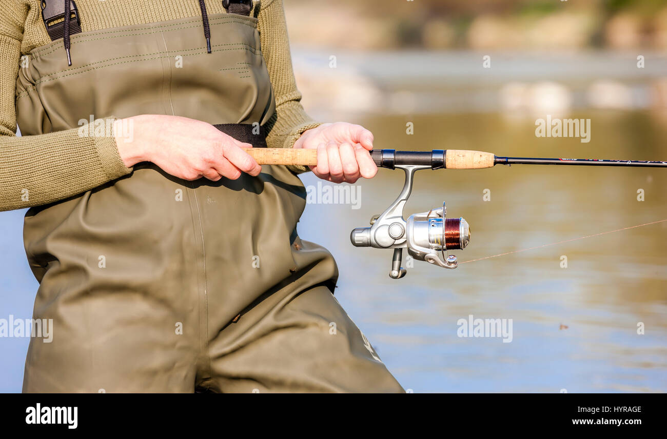 Woman Holding Fishing Rod With One Hand High Resolution Stock ...
