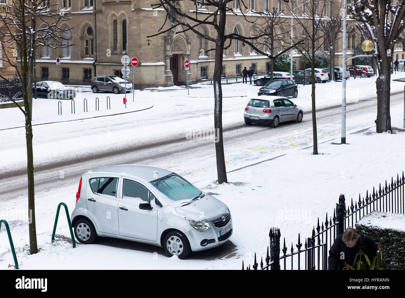 Car parked on pavement, cars traffic, snow, winter, Strasbourg, Alsace ...