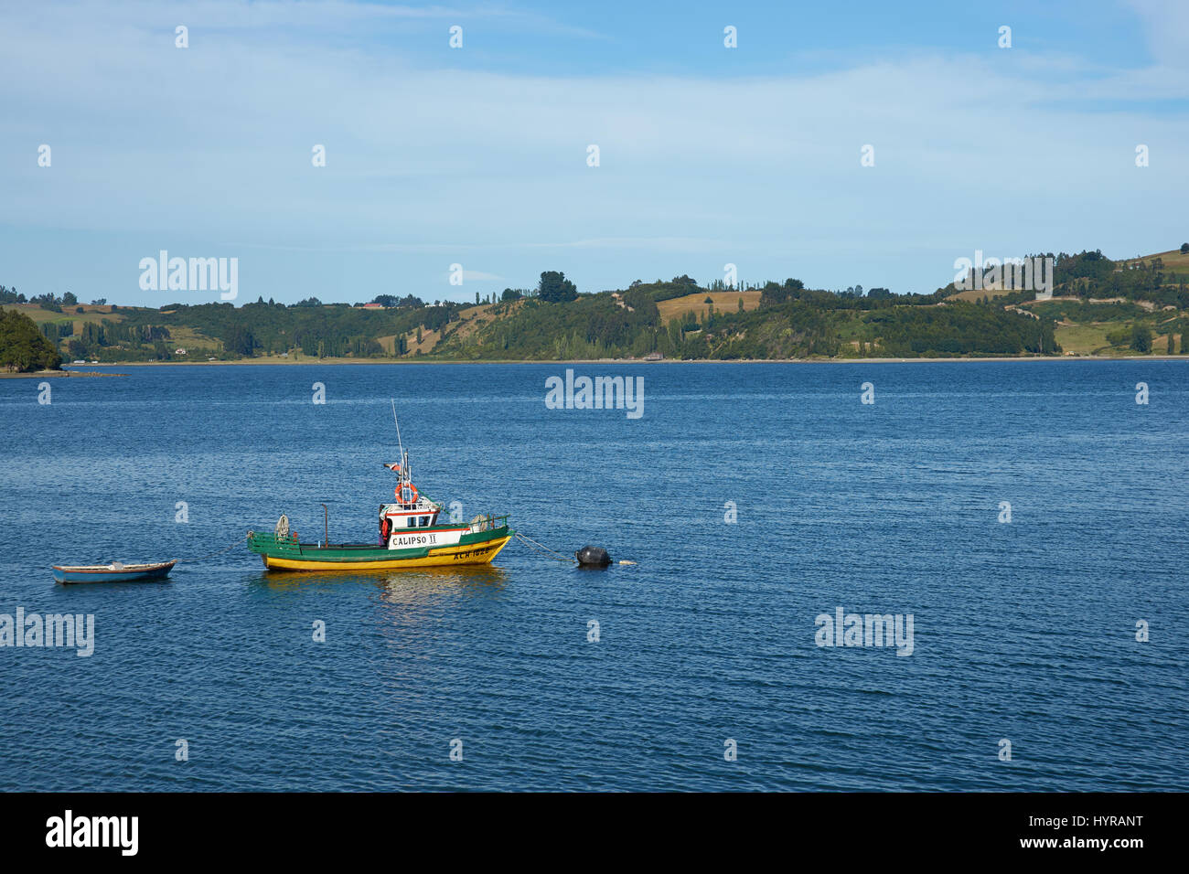 Fishing boat at anchor in the coastal waters off Castro, capital of the ...