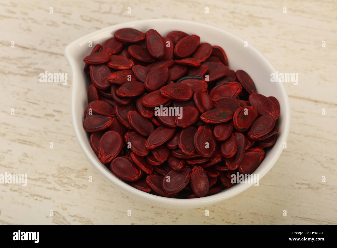 Dry red Pumpkin seeds over wooden background Stock Photo - Alamy