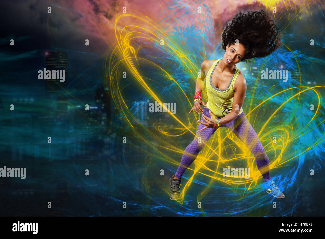 young woman at fitness dancing in front of fireworks Stock Photo - Alamy