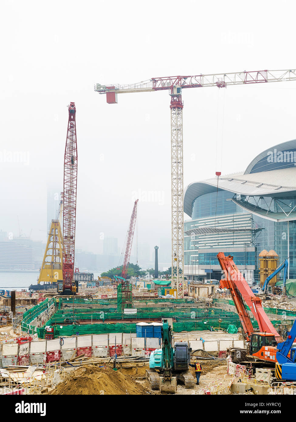 Construction site with workers in the center of HK Stock Photo - Alamy