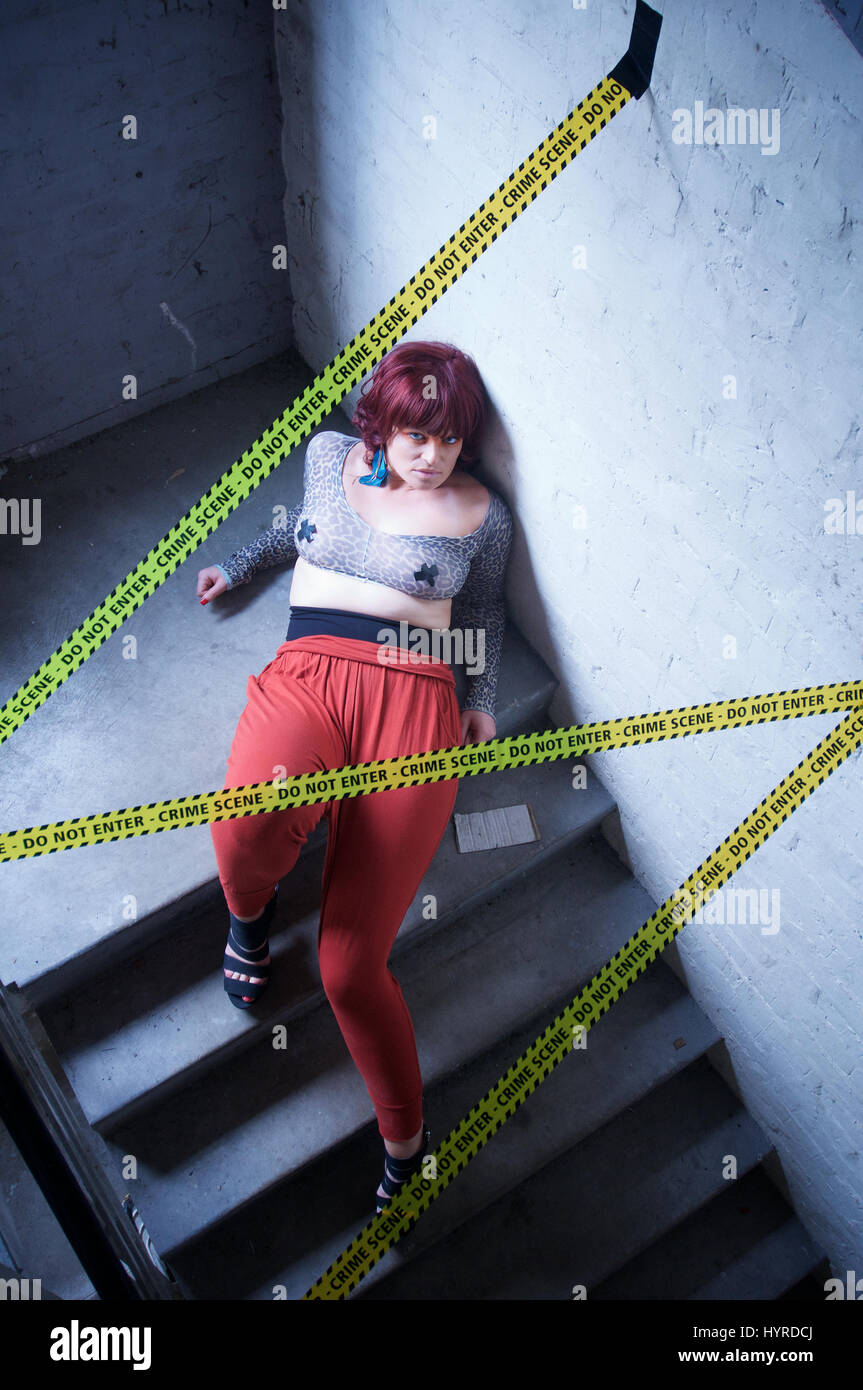 Model posing as a victim of crime at a crime scene indoors Stock Photo ...