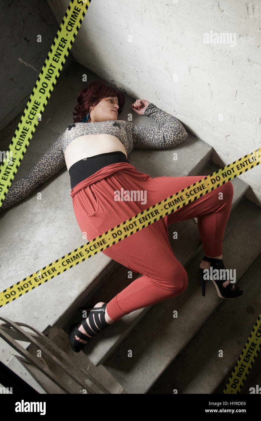 Model posing as a victim of crime at a crime scene indoors Stock Photo ...