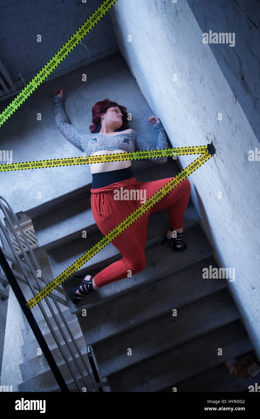 Model posing as a victim of crime at a crime scene indoors Stock Photo ...