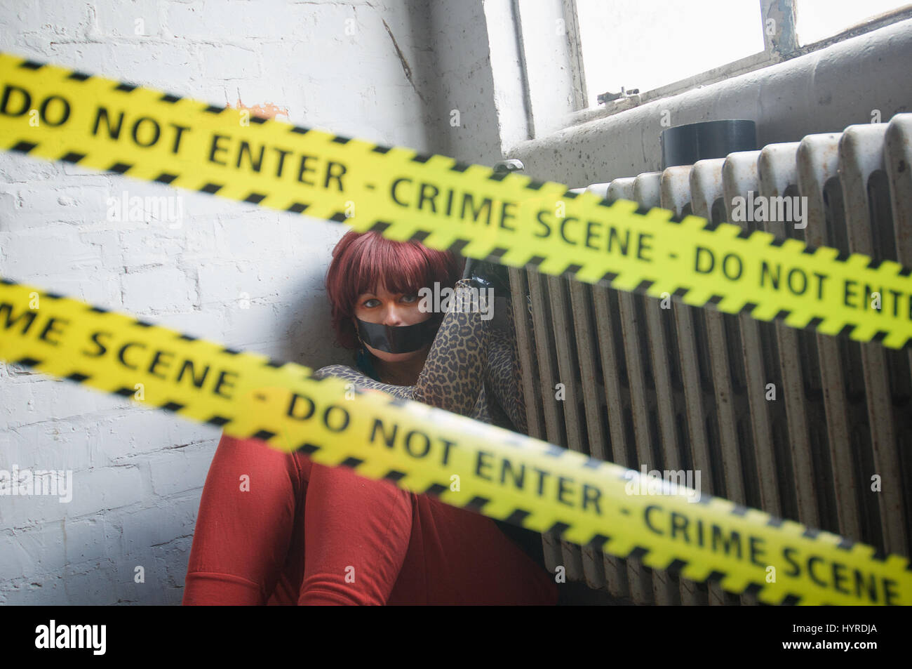 Model posing as a victim of crime at a crime scene indoors Stock Photo ...