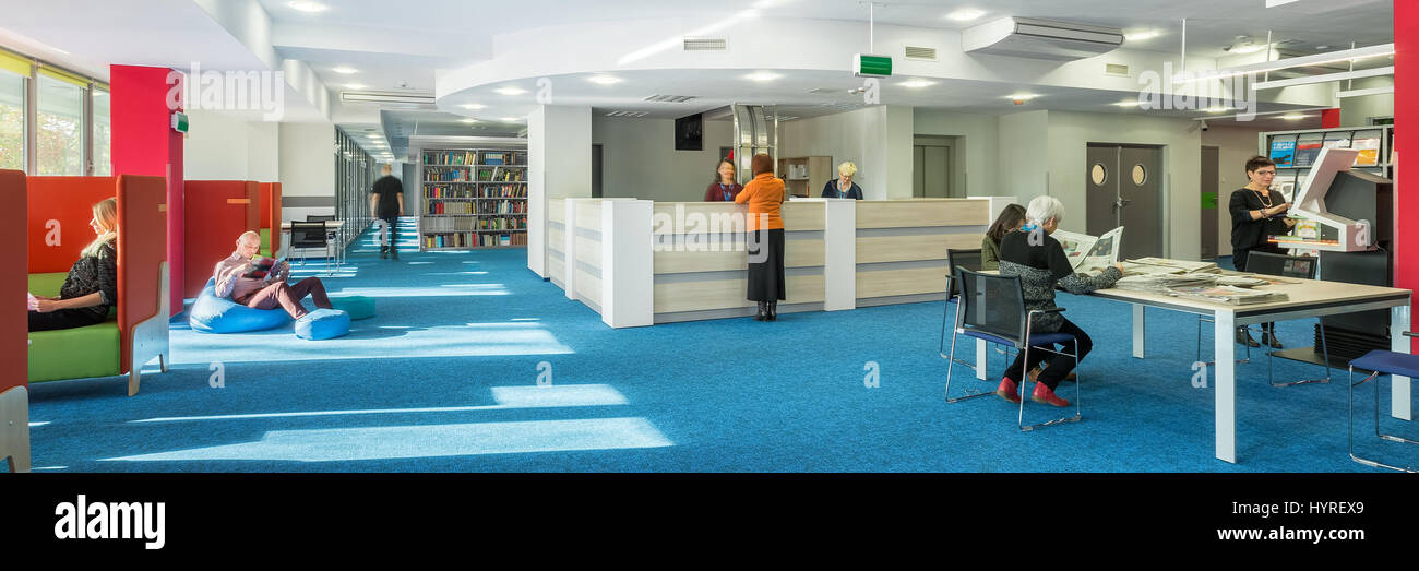 Panorama of modern and spacious university library with blue carpet on ...