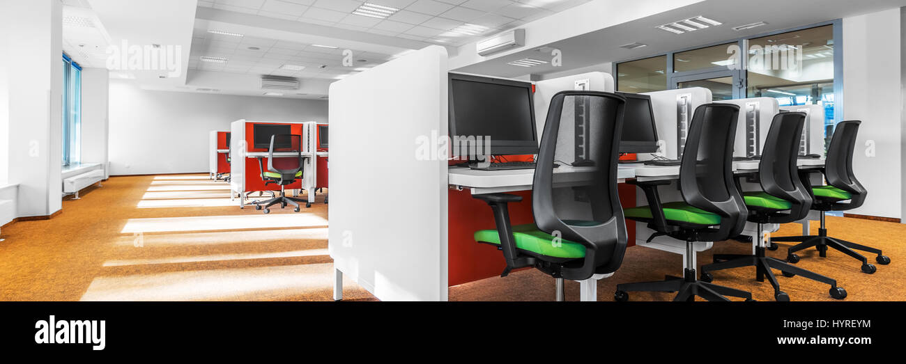 Panorama of stylish computer classroom with modern orange carpet on the ...